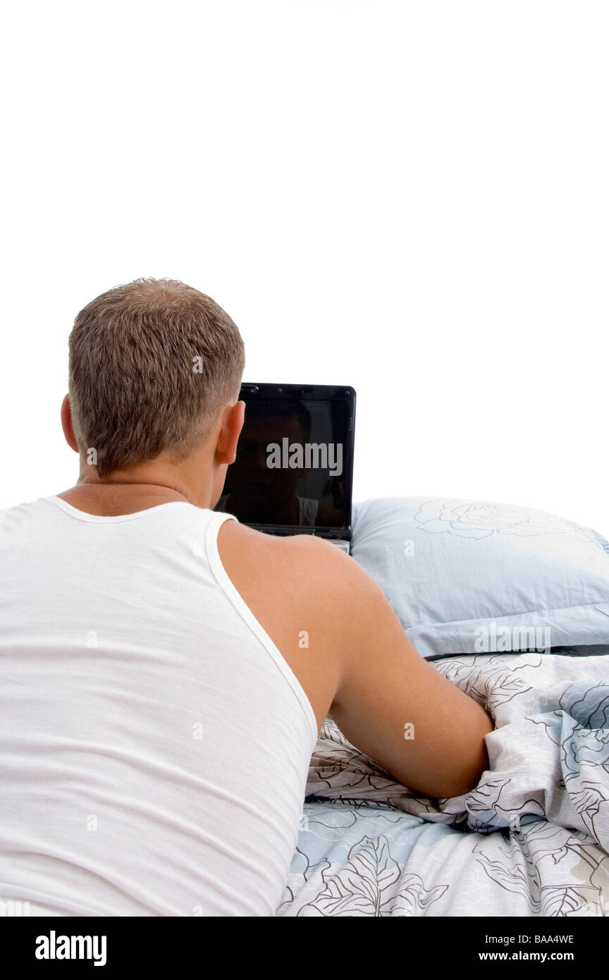back pose of laying man with laptop Stock Photo - Alamy