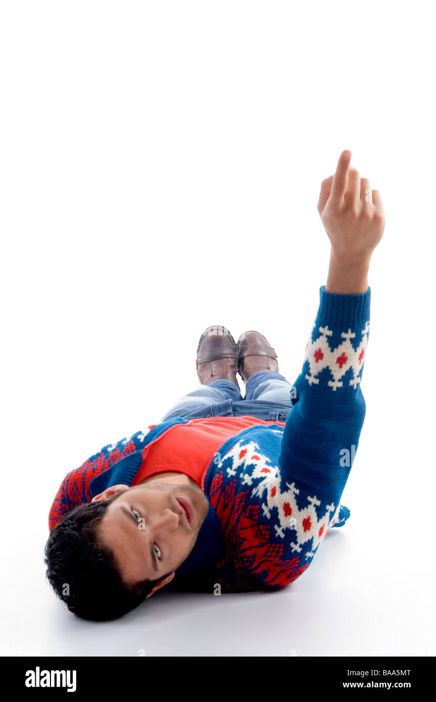 laying handsome young man pointing upward Stock Photo - Alamy