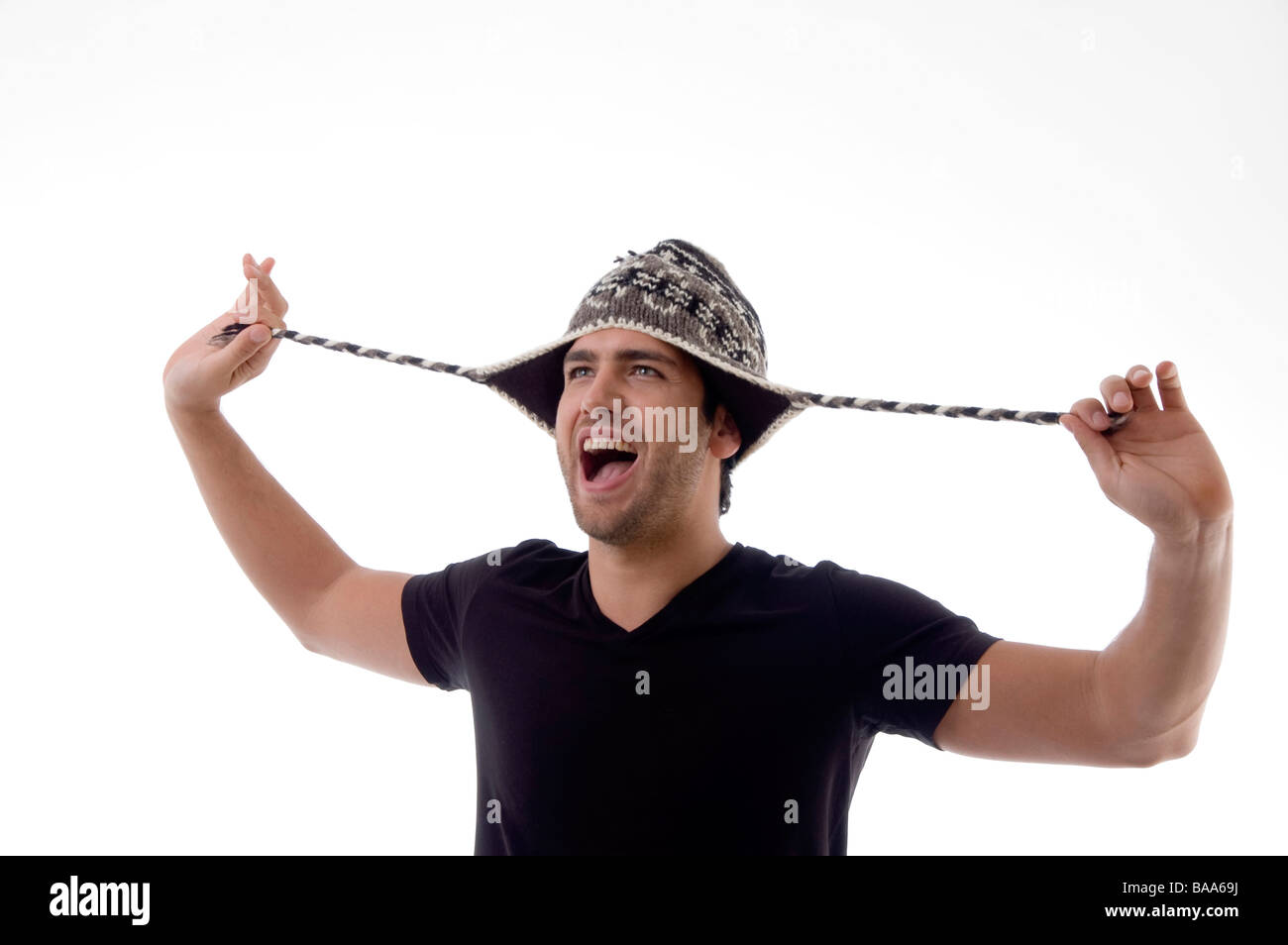 young man playing with his cap Stock Photo - Alamy