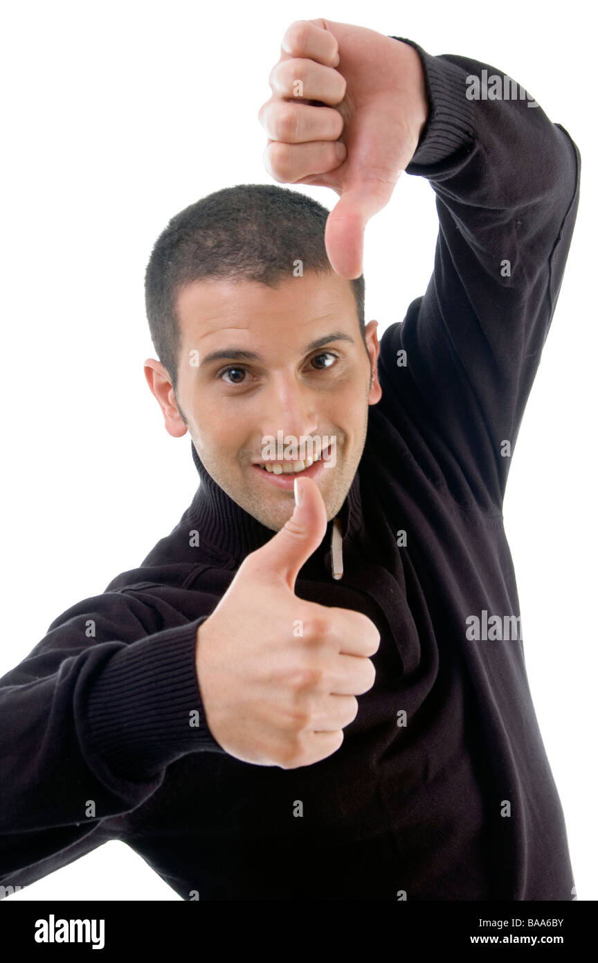 young guy with thumbs up and down Stock Photo - Alamy