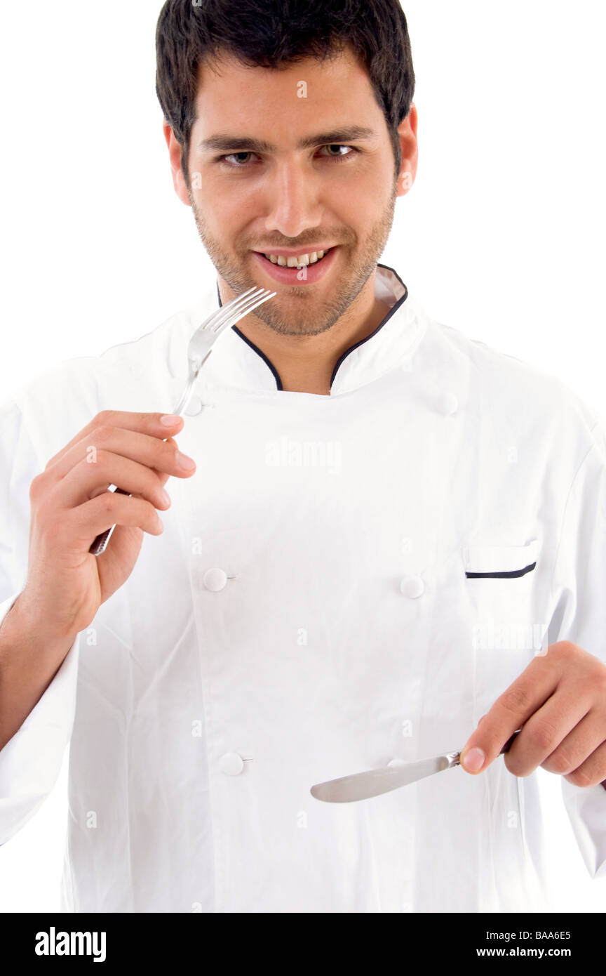 portrait of young male chef showing eating etiquettes Stock Photo - Alamy