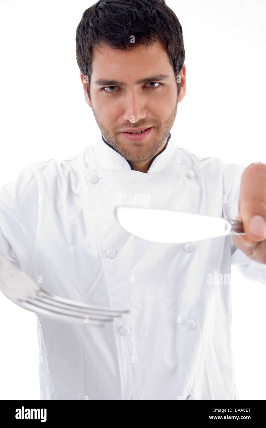 portrait of male chef holding cutlery Stock Photo - Alamy