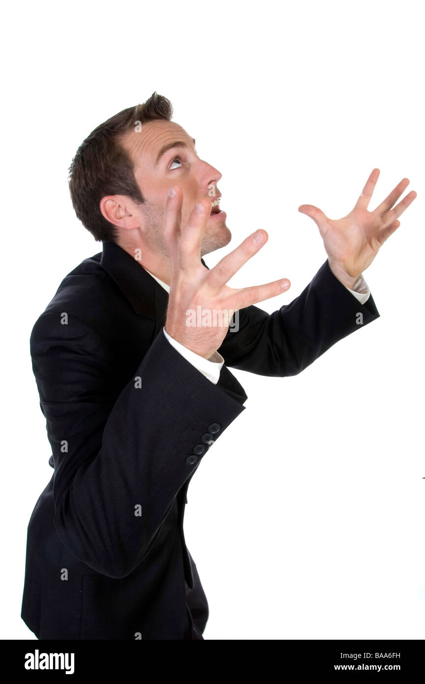 young businessman yelling with raised arms Stock Photo - Alamy