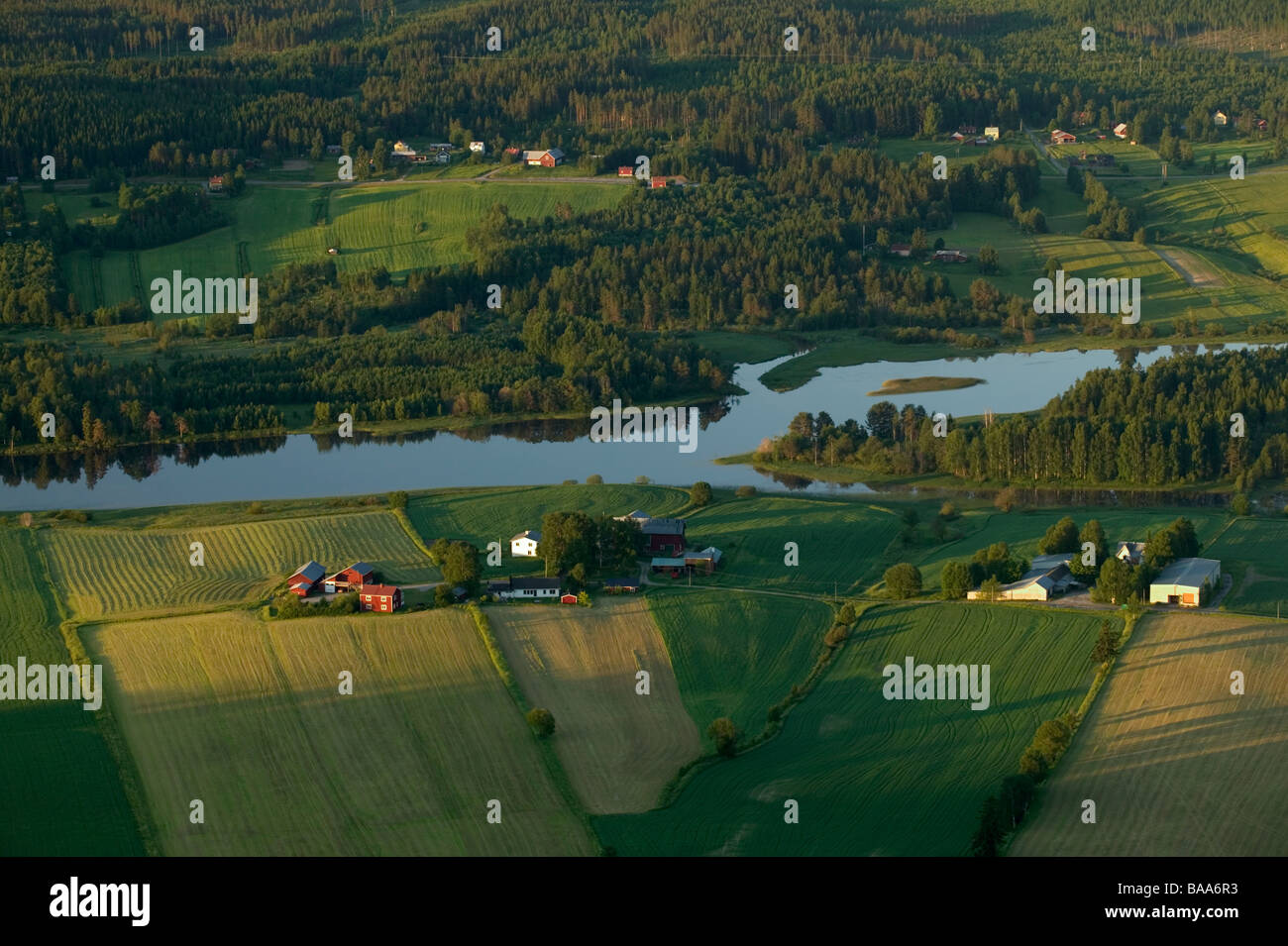 Fields and farms by the river Ljungan Medelpad Sweden Stock Photo - Alamy