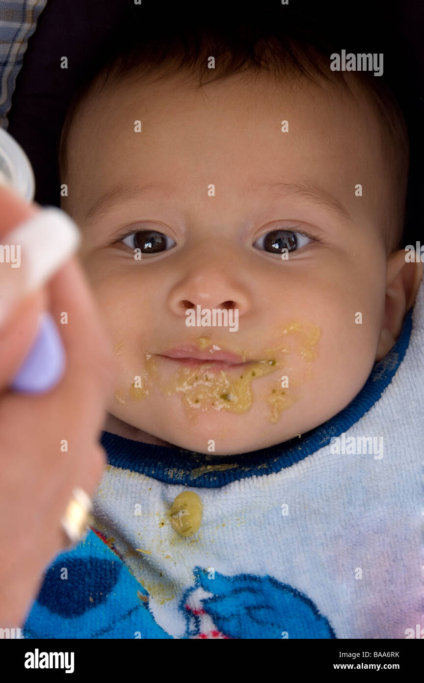 close up of baby eating food Stock Photo - Alamy