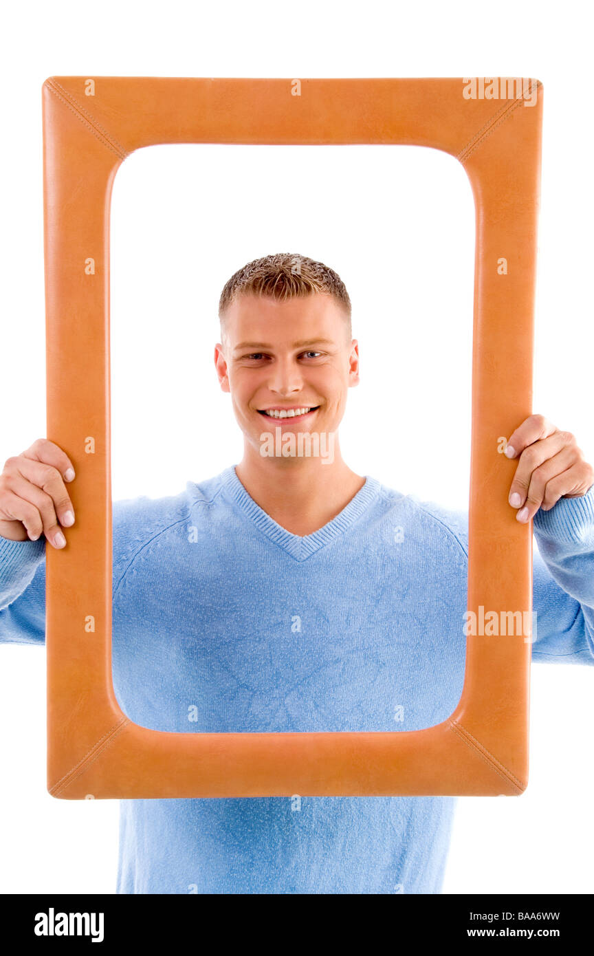 frame - smiling adult man looking through window Stock Photo - Alamy