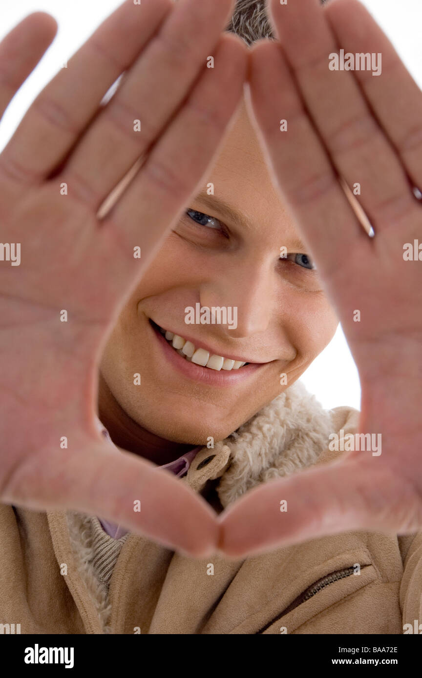 smiling man showing hand gesture Stock Photo - Alamy