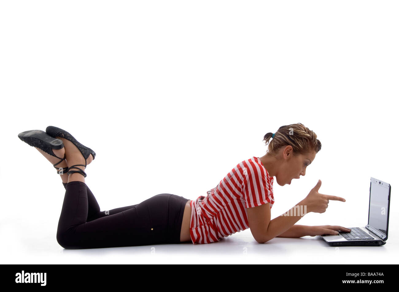 female laying working on laptop Stock Photo - Alamy