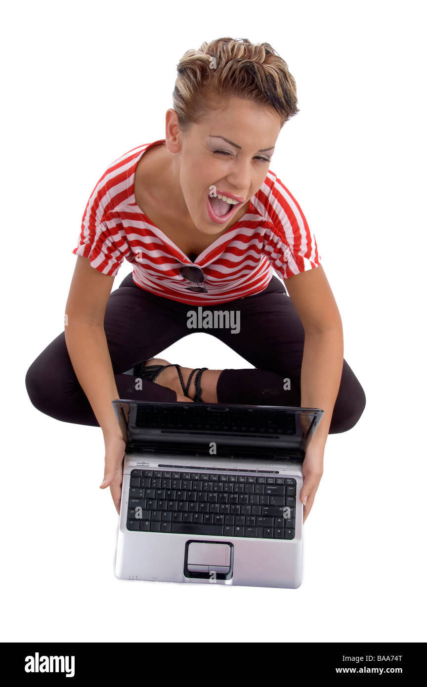 winking beautiful model with laptop Stock Photo - Alamy