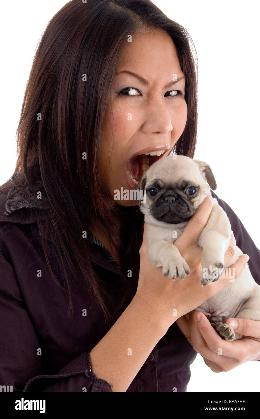 shouting female holding puppy Stock Photo - Alamy