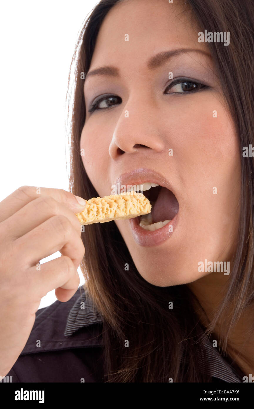 pretty woman eating cookies Stock Photo - Alamy