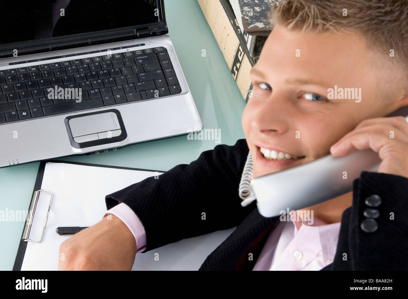 executive posing with phone receiver Stock Photo - Alamy