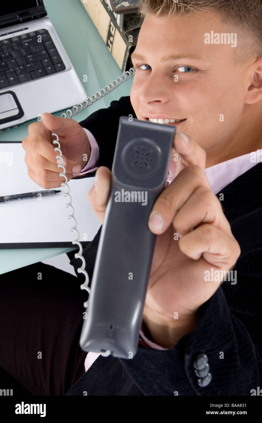 boss showing phone receiver Stock Photo - Alamy