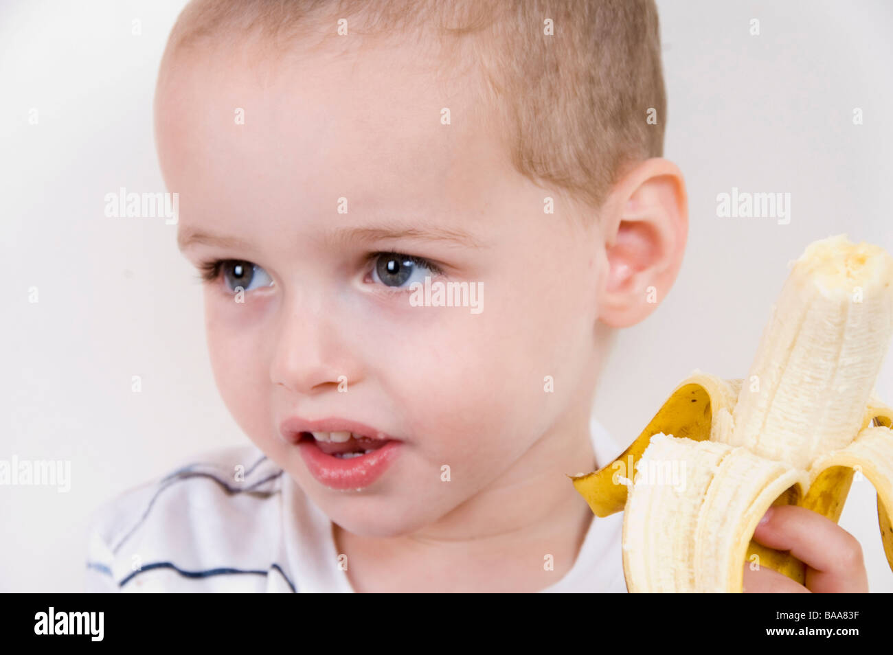 little boy with peeled banana Stock Photo - Alamy