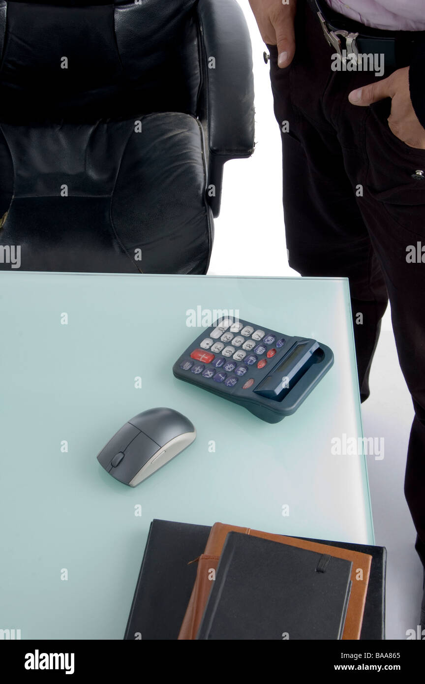 calculator and mouse on desk Stock Photo - Alamy