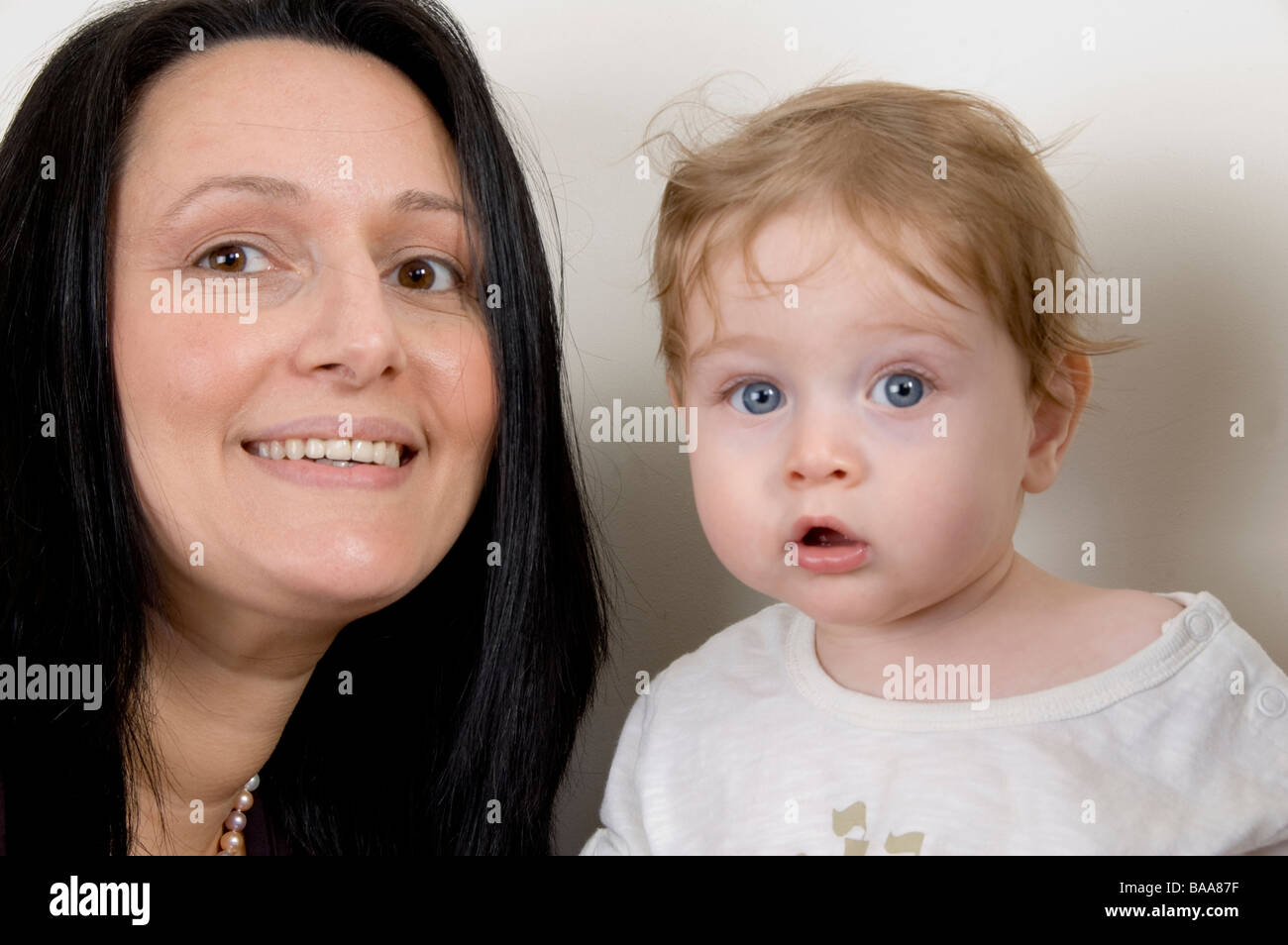mother and child looking to camera Stock Photo - Alamy