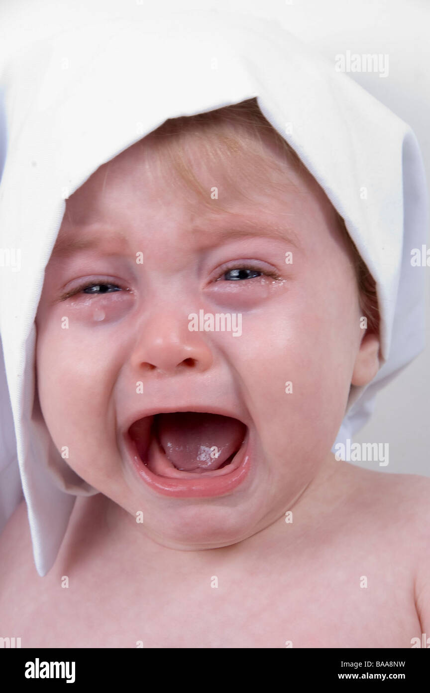 weeping cute baby with chef cap and pot Stock Photo - Alamy