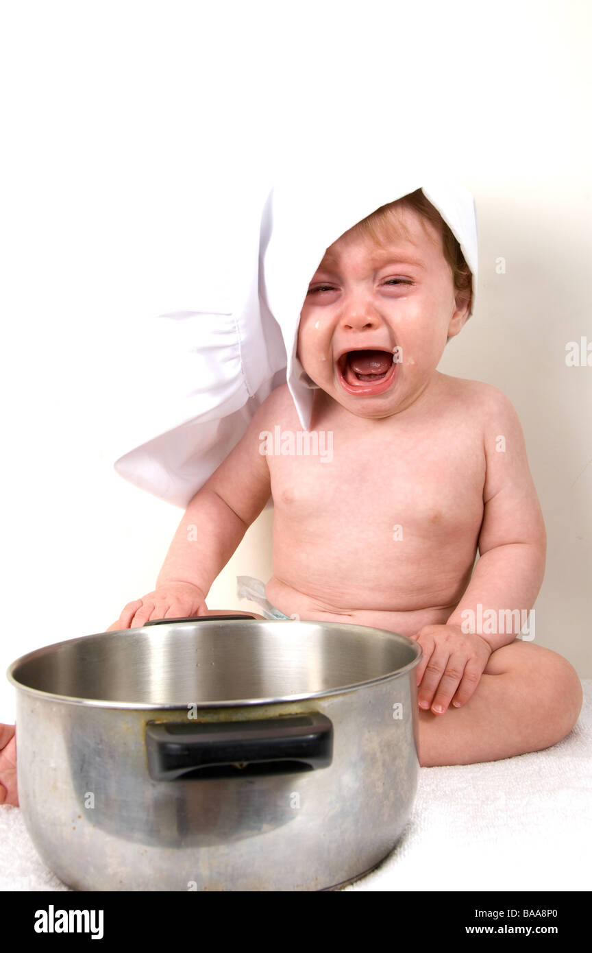 crying baby with pan and cap Stock Photo - Alamy