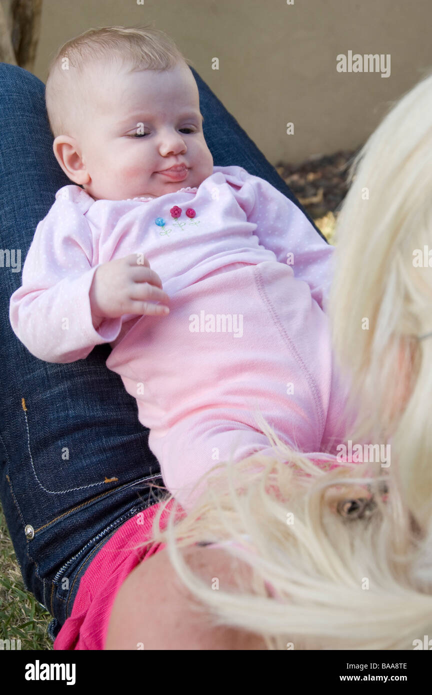 young baby looking his with curiosity Stock Photo - Alamy