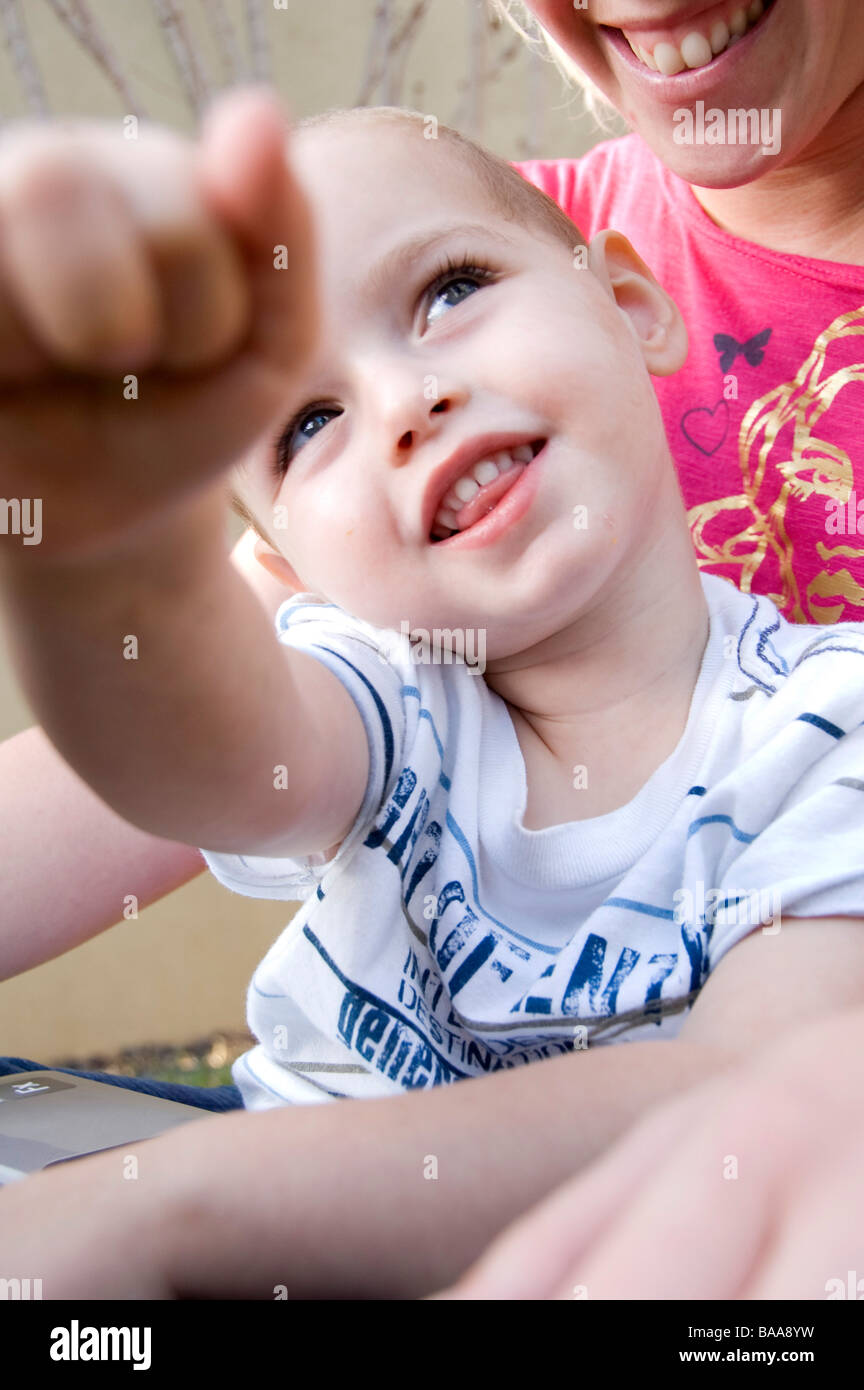 adorable young kid pointing towards camera Stock Photo - Alamy
