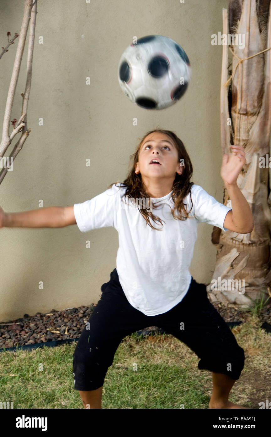 Football on the head hi-res stock photography and images - Alamy