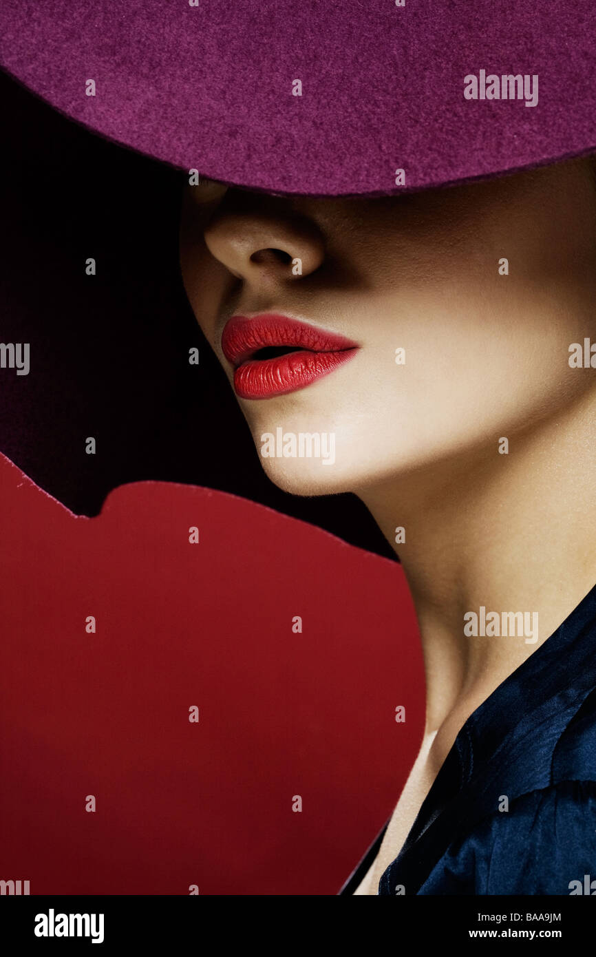 Young woman wearing a violet hat Stock Photo - Alamy