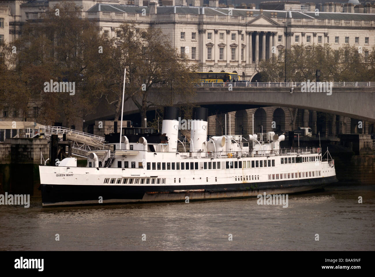 The Queen Mary ship moored near Waterloo Bridge on the River Thames ...