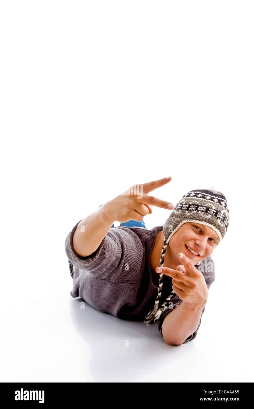 laying handsome man showing peace sign Stock Photo - Alamy