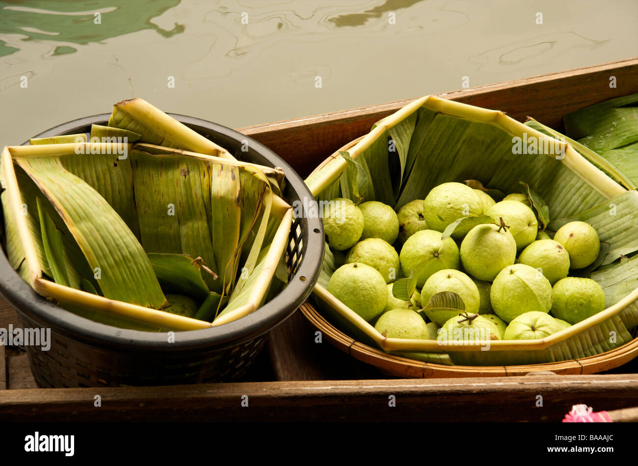 Green Thai apples on a boat in the floating market near Bangkok ...