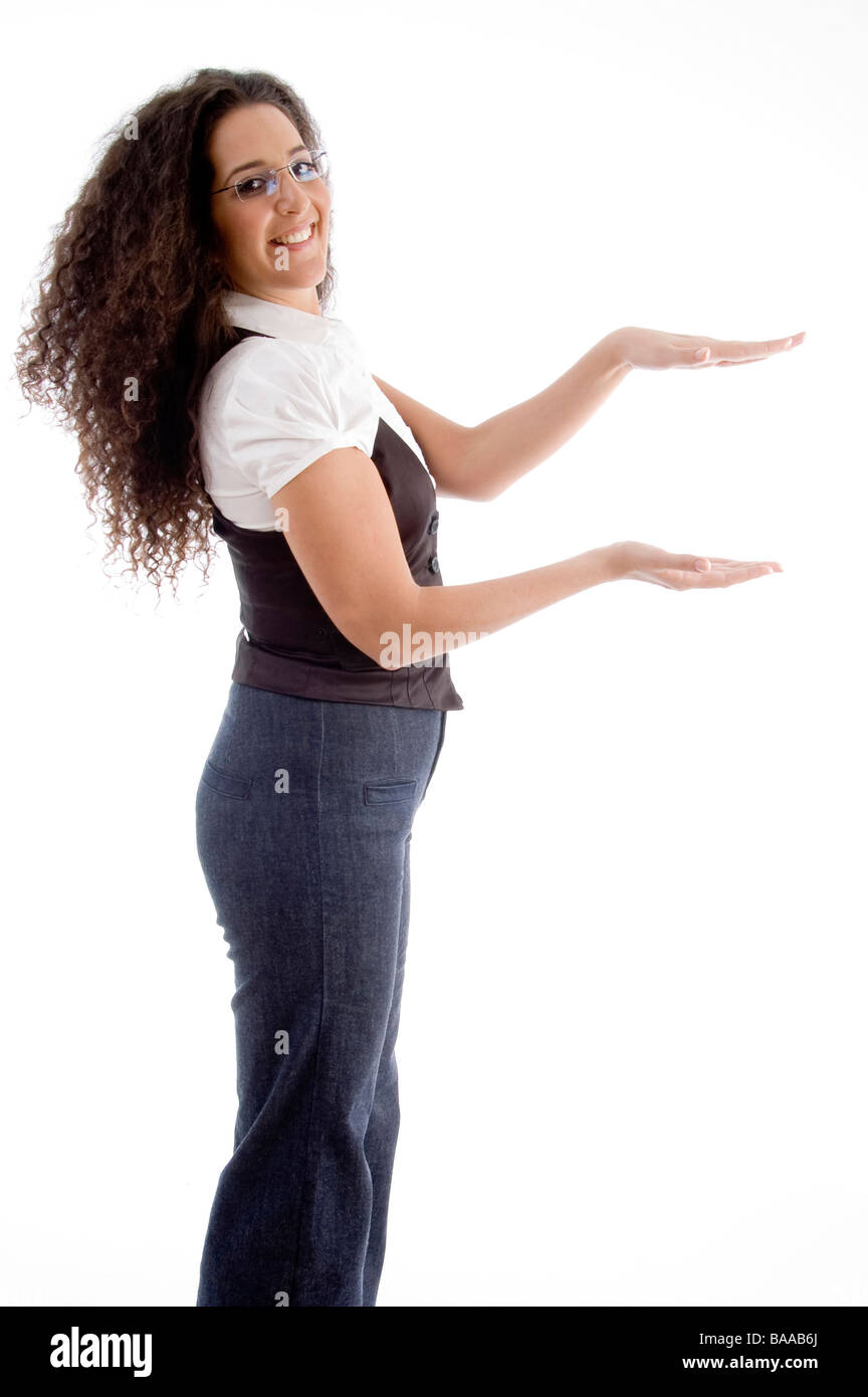 young woman posing like holding something with hand gesture Stock Photo ...