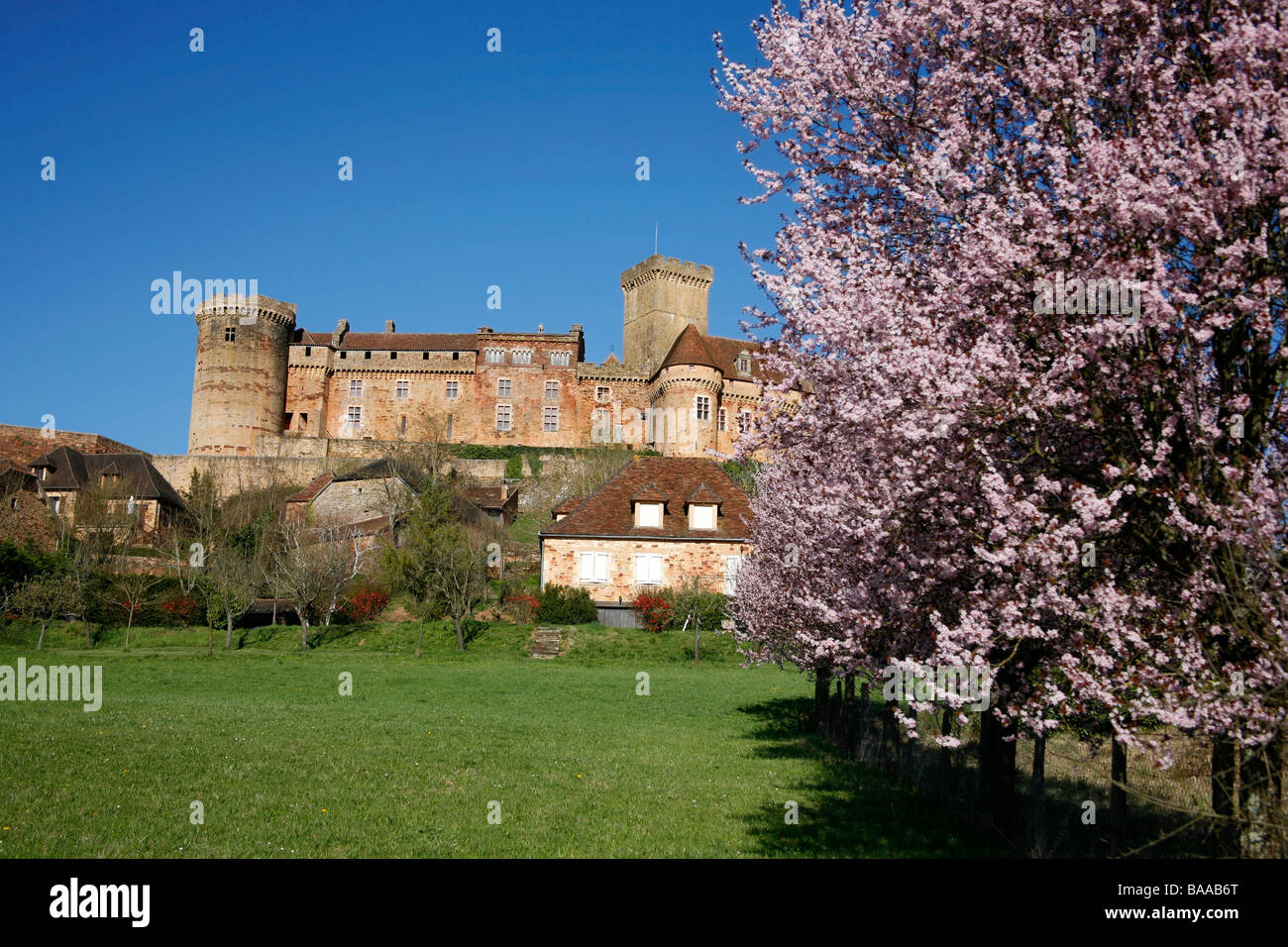 Castle and old village of Bretenoux in green fields France Stock Photo ...