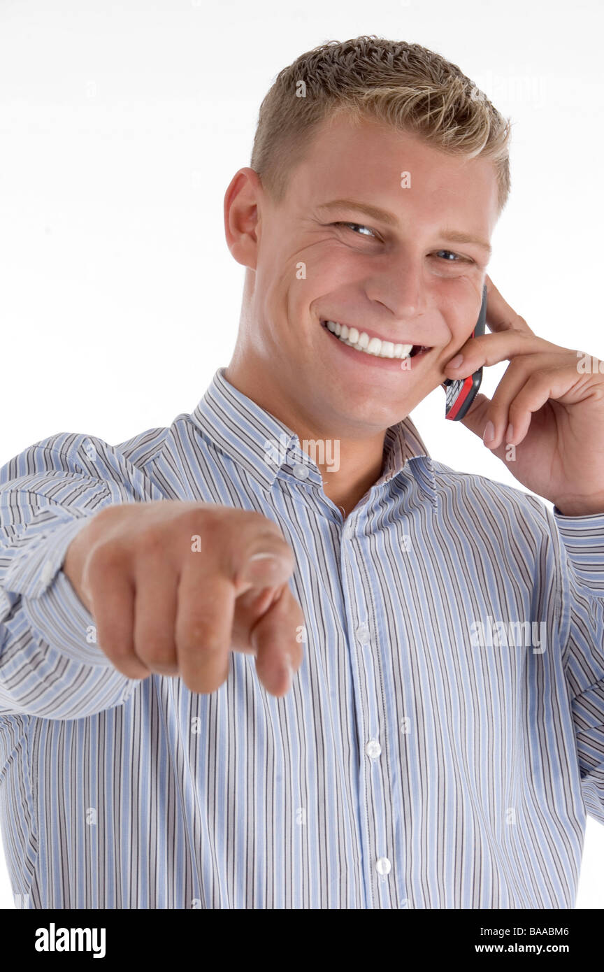 pointing man talking on mobile Stock Photo - Alamy
