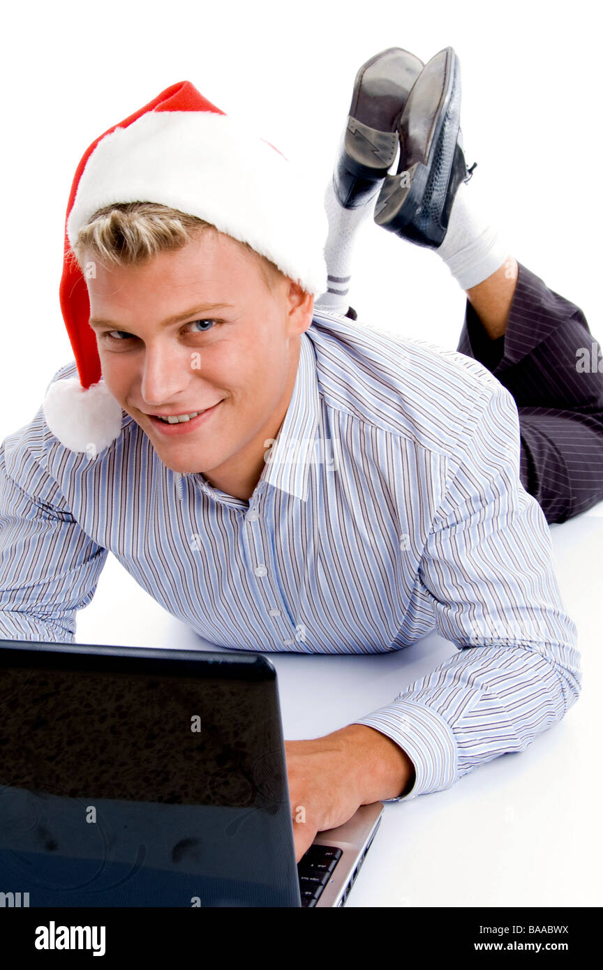 young man with laptop and chritsmas hat Stock Photo - Alamy