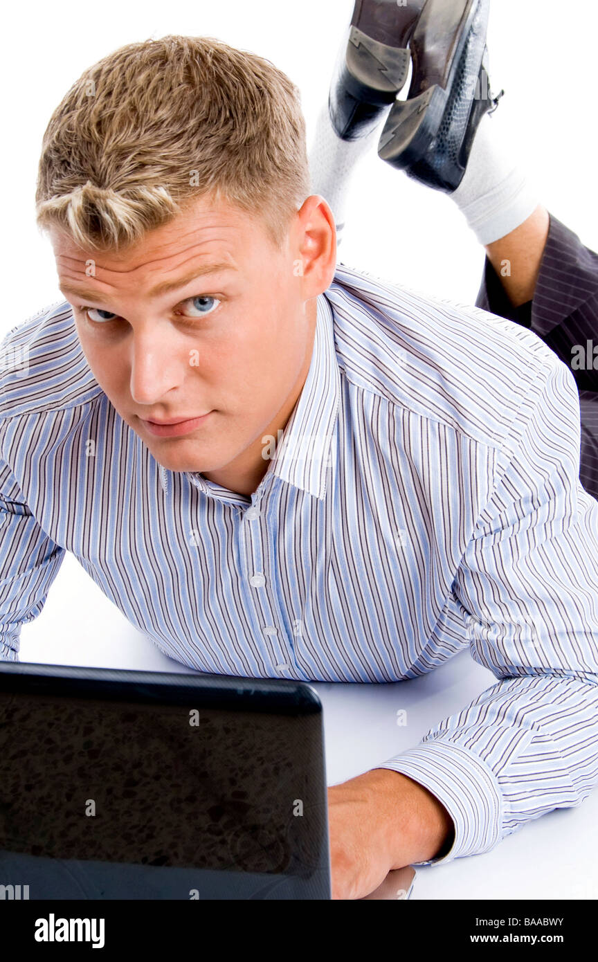 laying man with laptop Stock Photo - Alamy