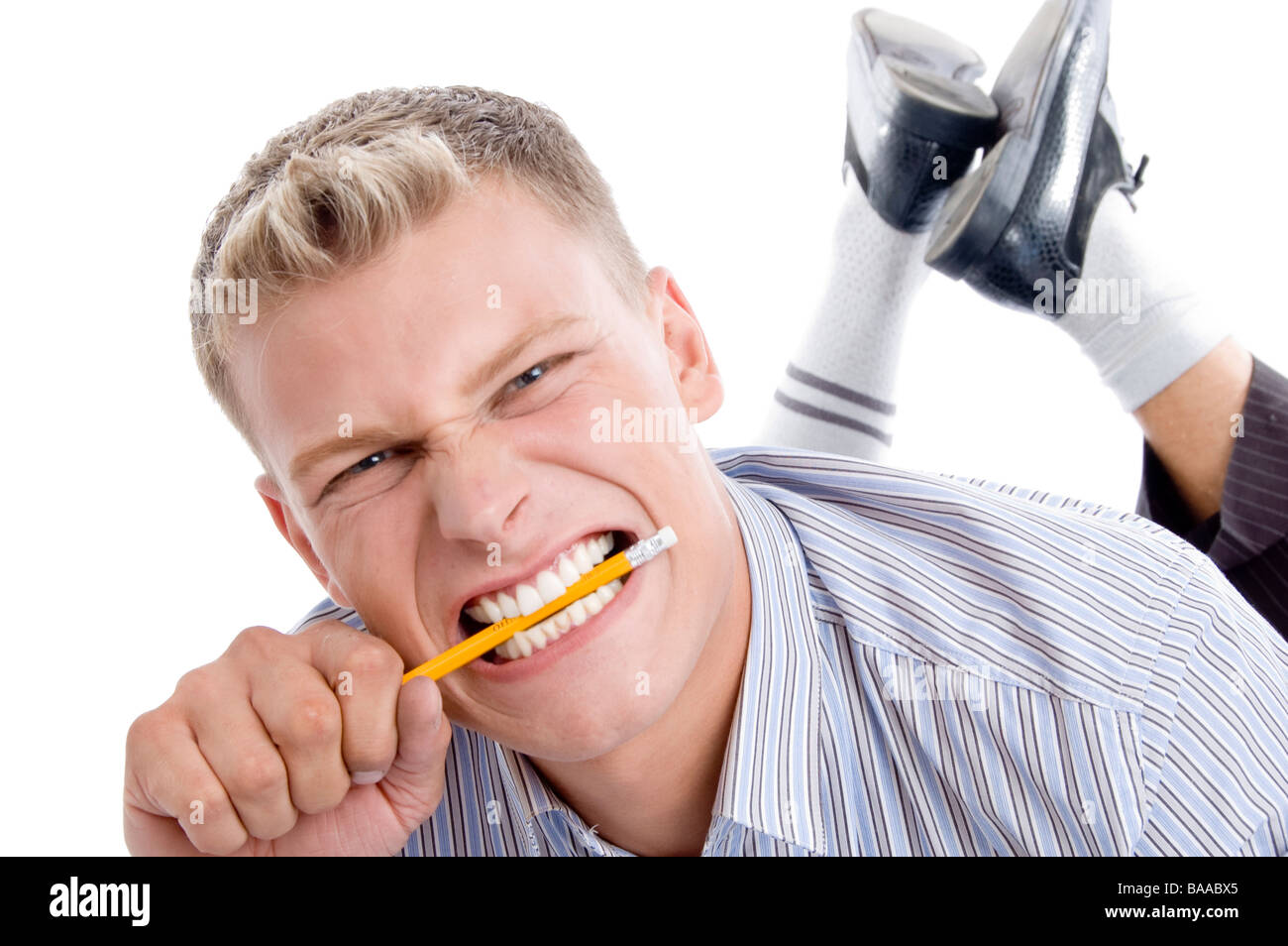 man holding pencil with teeth Stock Photo - Alamy