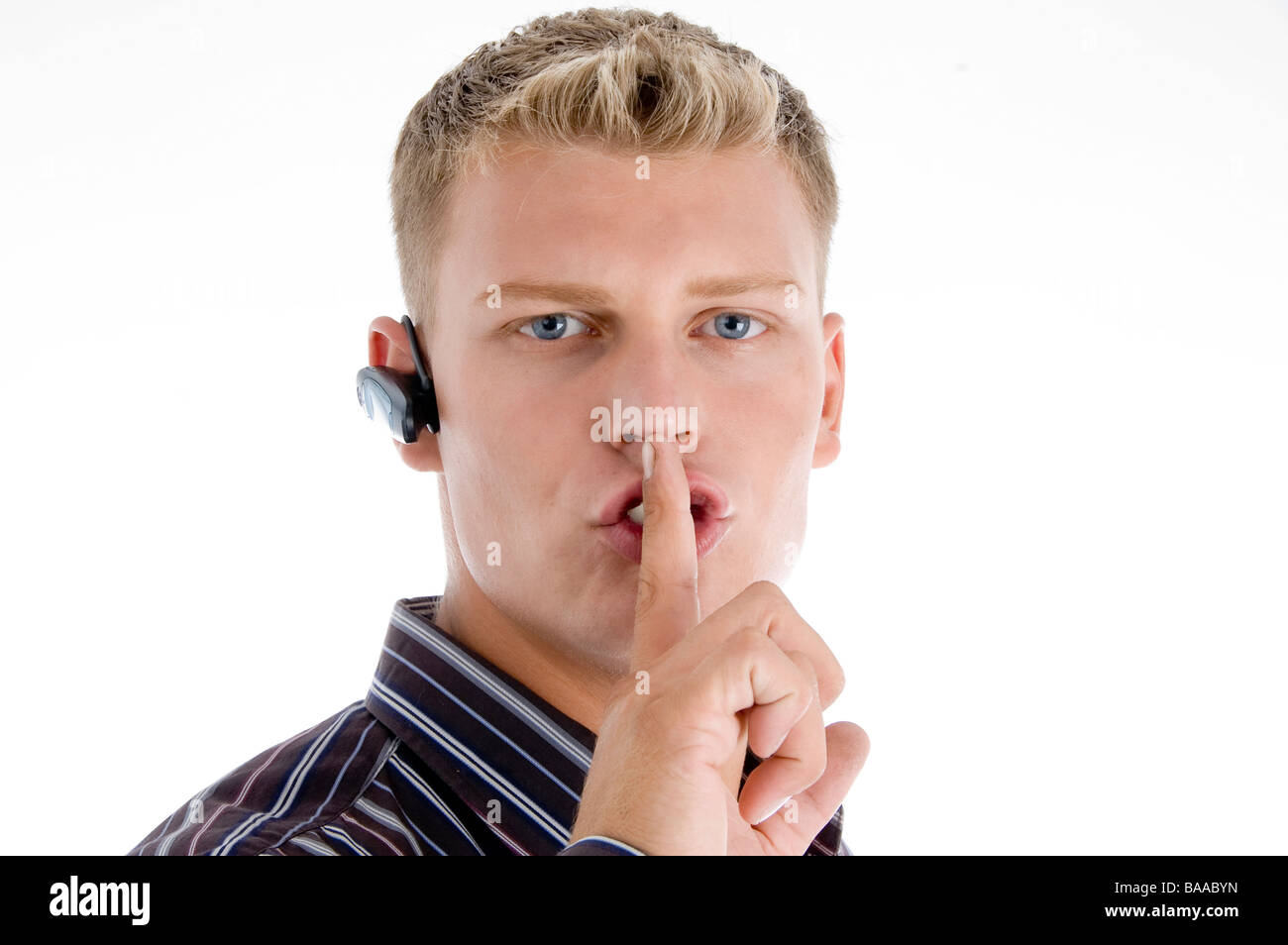 handsome male shushing Stock Photo - Alamy