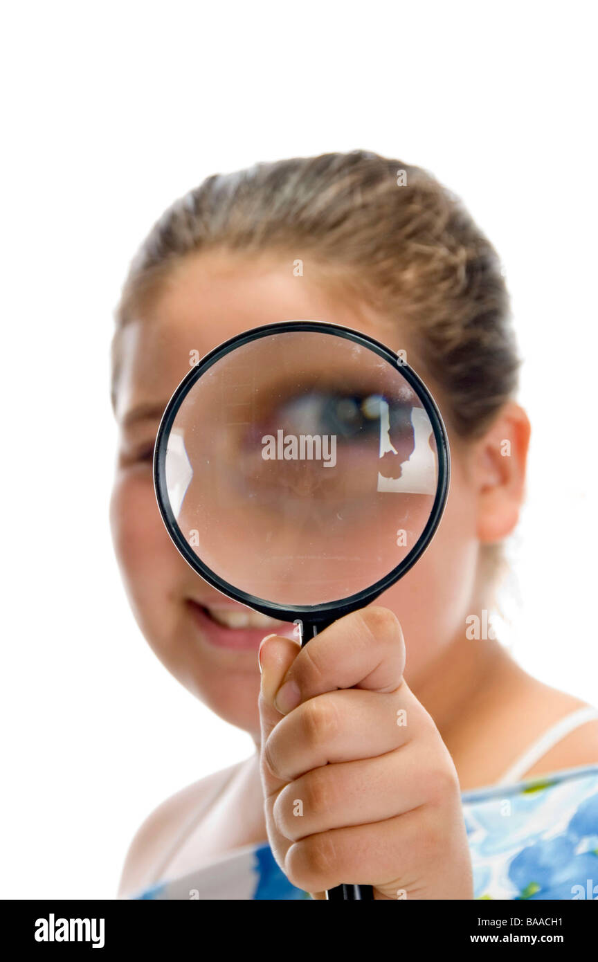 girl looking through magnifier Stock Photo - Alamy