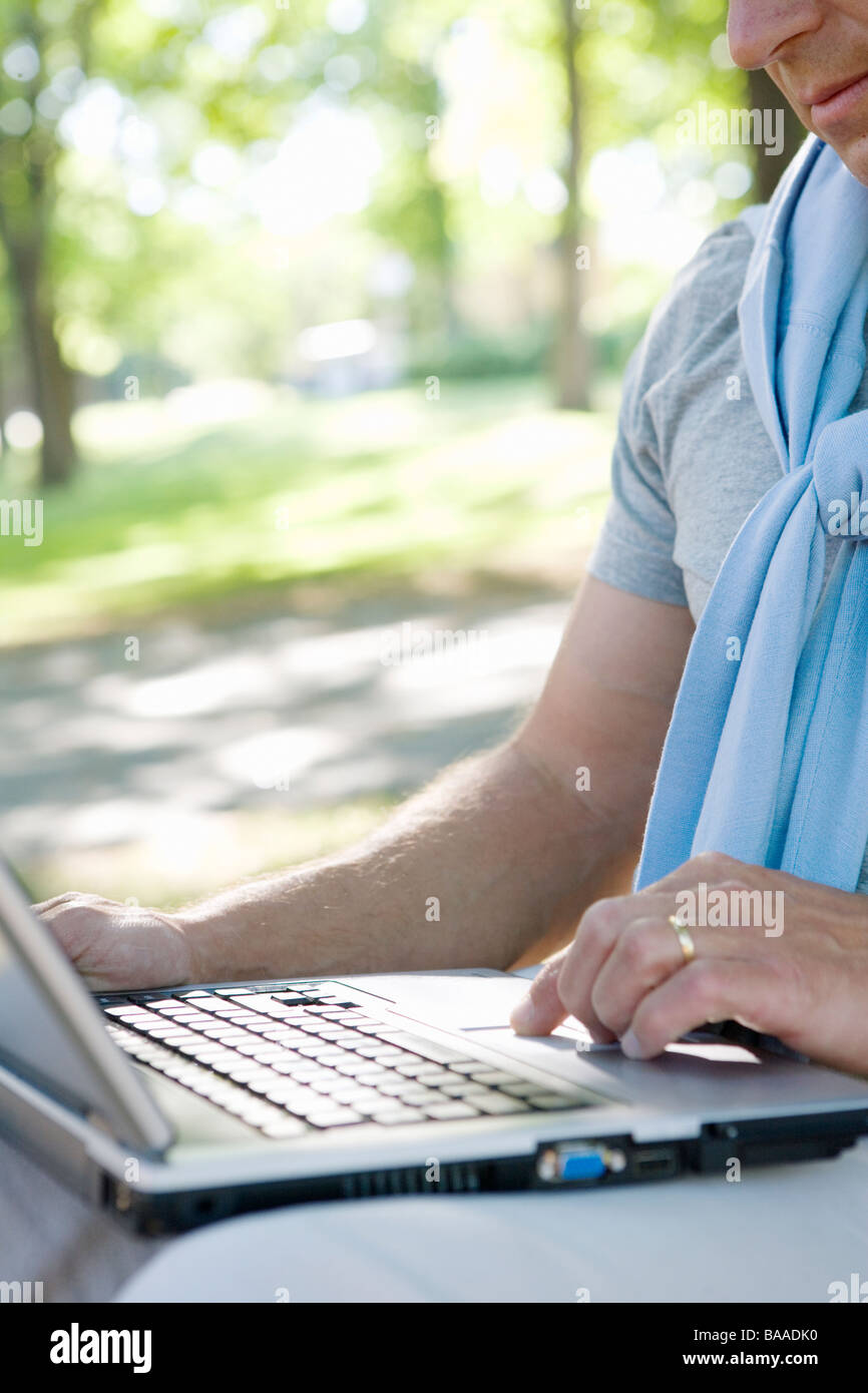 A man using his laptop outdoors, Stockholm, Sweden Stock Photo - Alamy