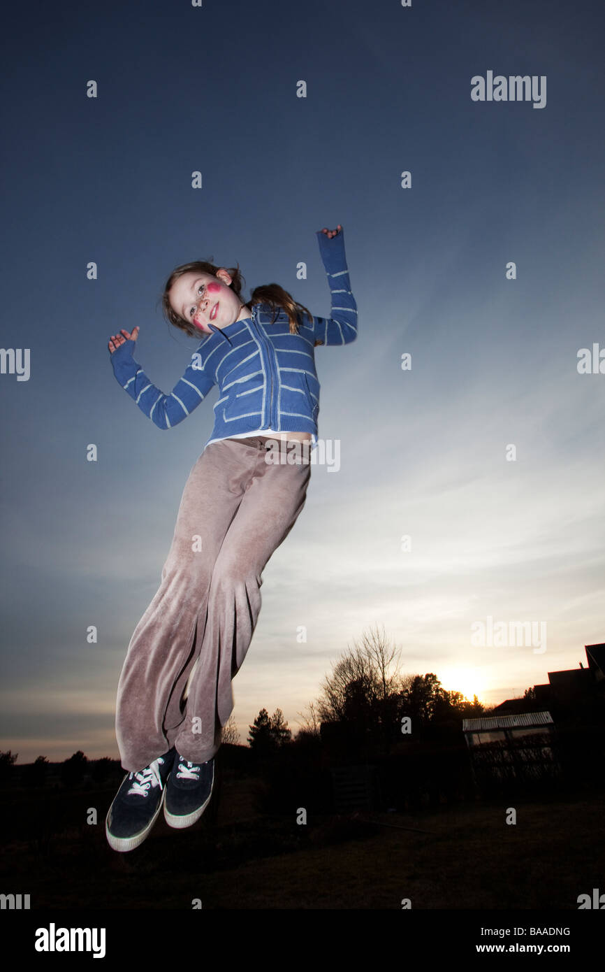 Girl jumping up in the air Stock Photo - Alamy