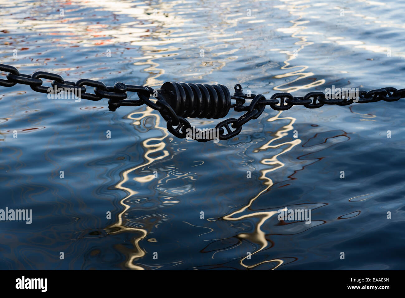A chain in a harbour, Sweden Stock Photo - Alamy
