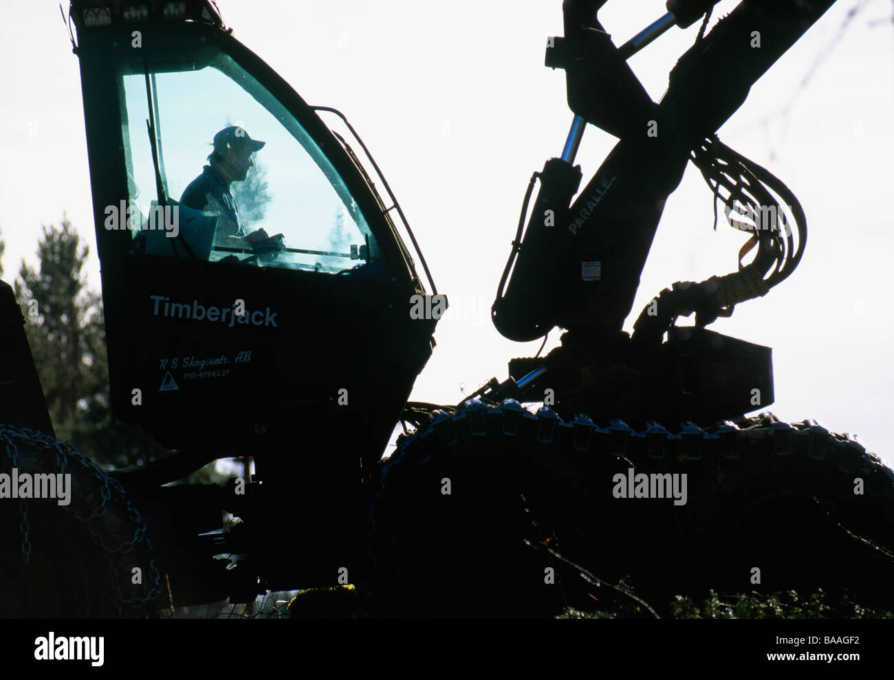 Man driving crane Stock Photo - Alamy