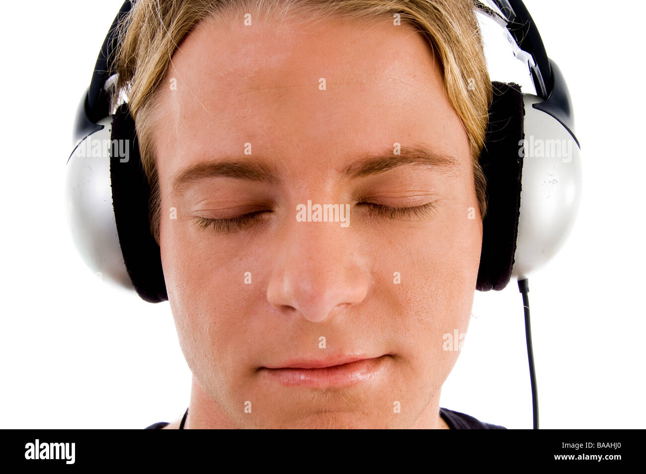 handsome male tuned into music Stock Photo - Alamy
