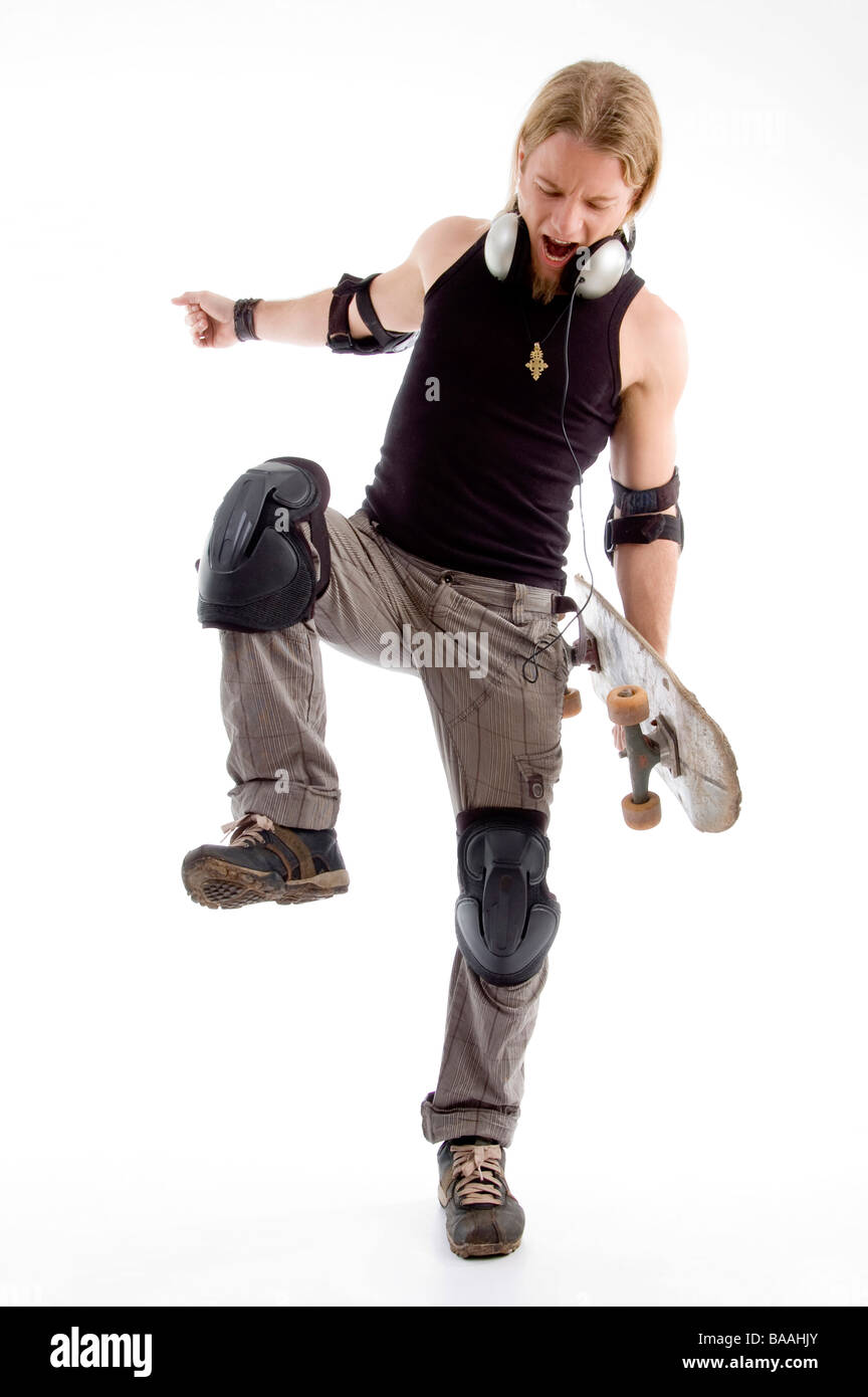angered man beating something with his leg Stock Photo - Alamy