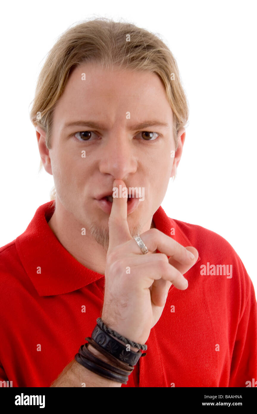 handsome young guy shushing Stock Photo - Alamy