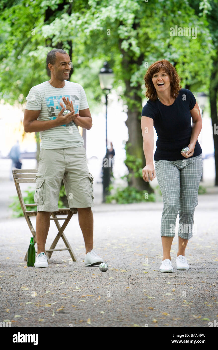 A man and a woman playing boules, Stockholm, Sweden Stock Photo - Alamy