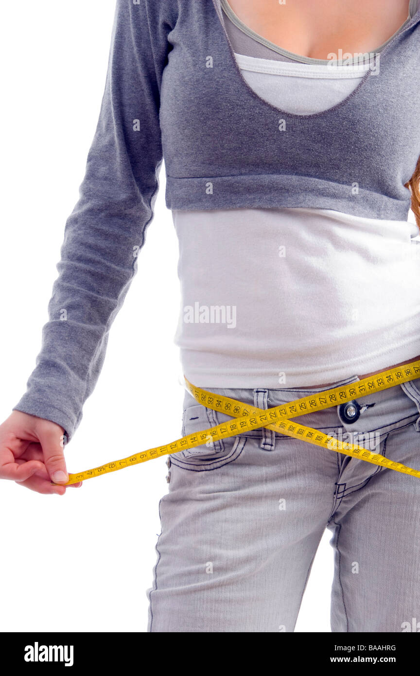 female measuring her waist with tape Stock Photo - Alamy