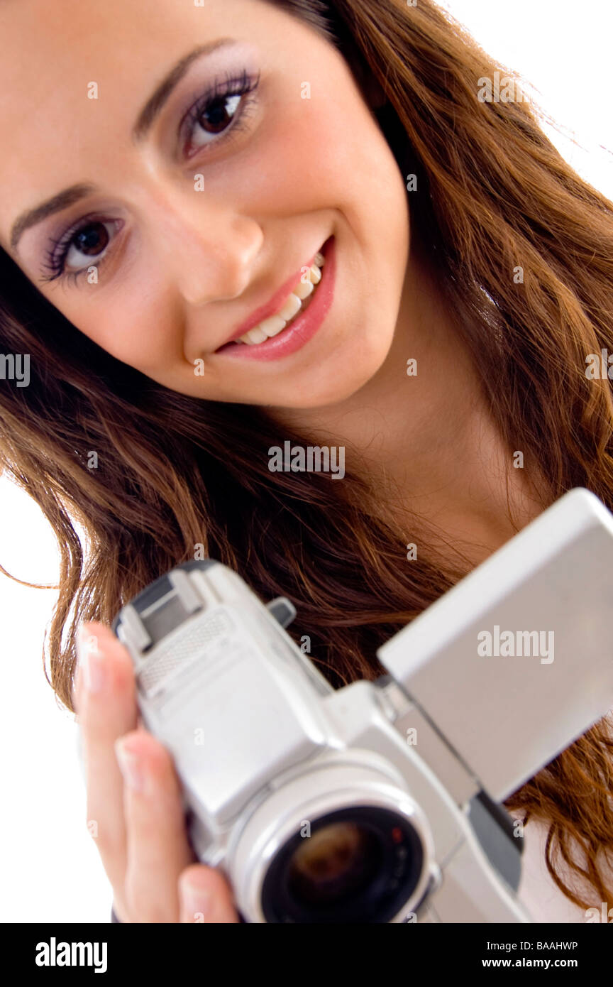 young female holding handy cam and looking at camera Stock Photo - Alamy