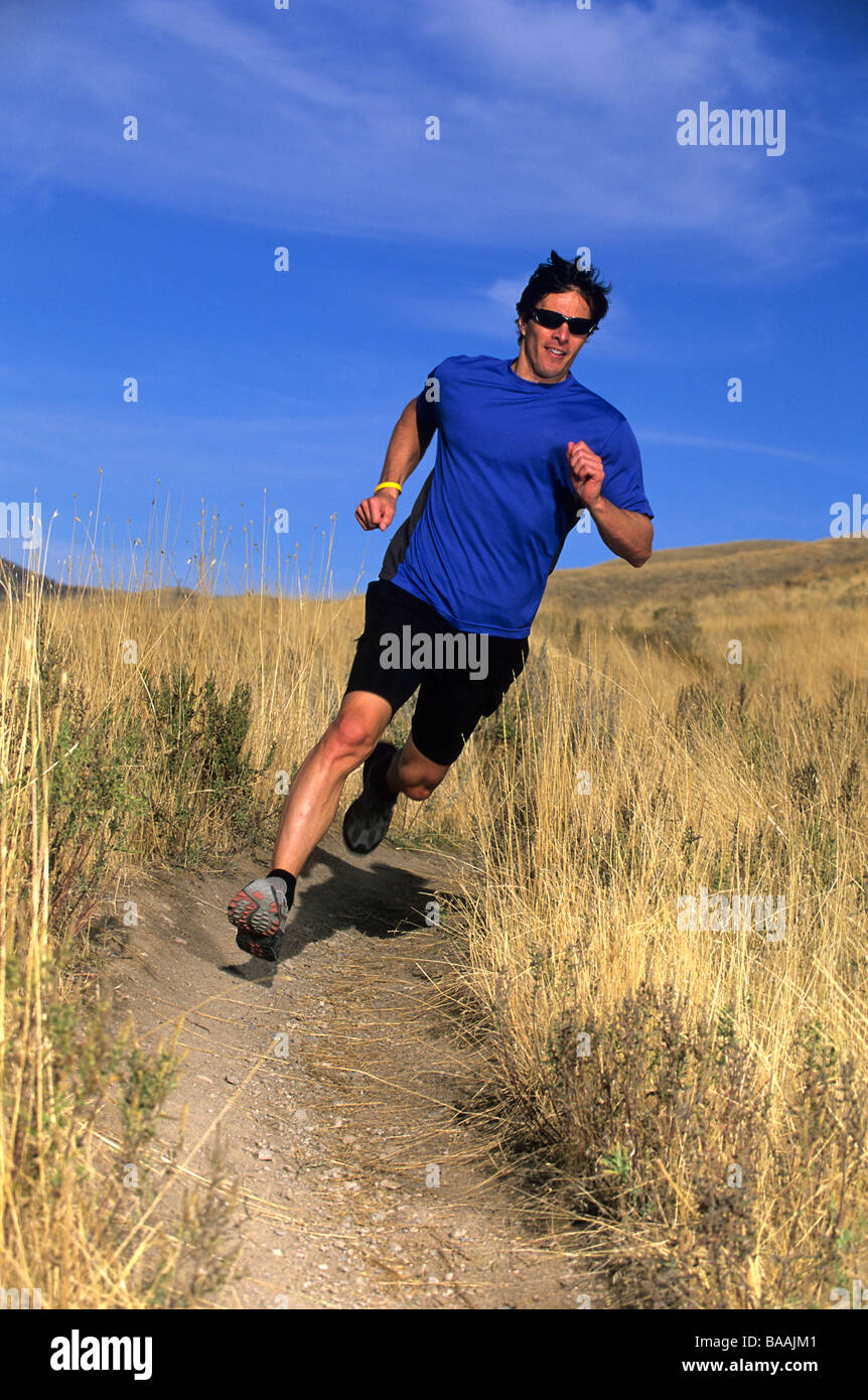 Man trail running in the foothills of Salt Lake City, Utah Stock Photo ...