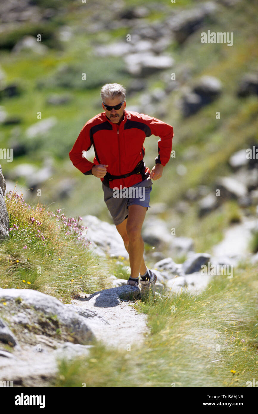 Man running in Val Ferret, Italy Stock Photo - Alamy