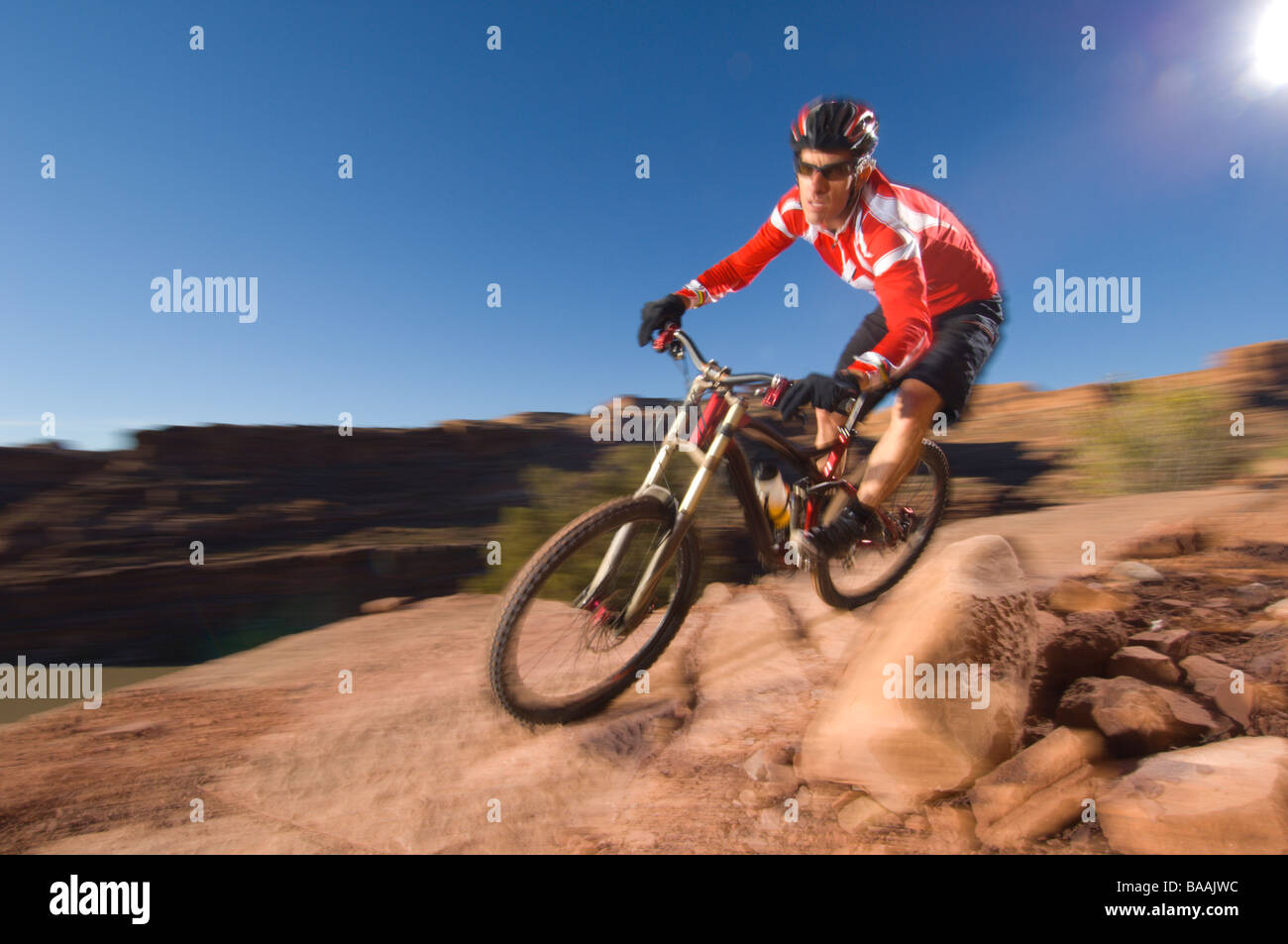 Man mountain biking on Porcupine Rim Trail in Moab, Utah Stock Photo ...